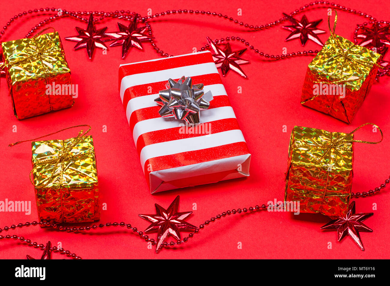 Christmas red background with gift and decoration on the red background ...