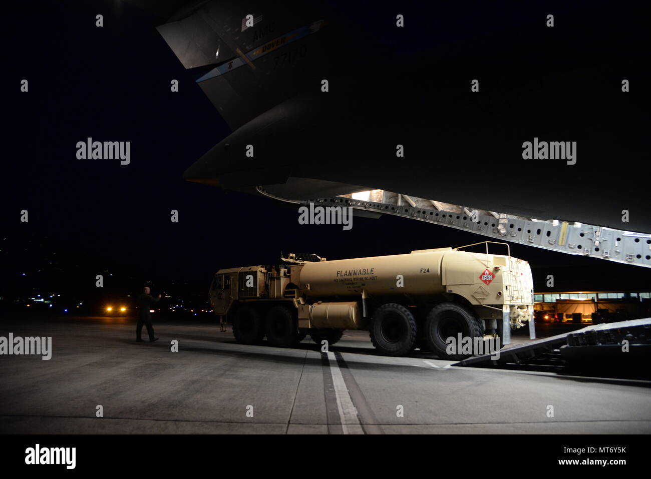 Loadmasters assigned to the 3d Airlift Squadron unload a M978A4 Fuel ...