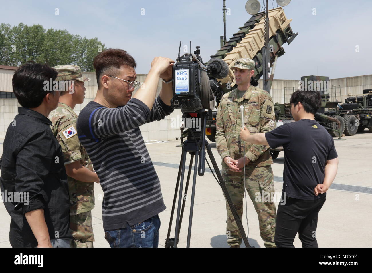 KBS News cameraman films U.S. Army Cpt. Christopher Walker, 6-52nd ADA ...