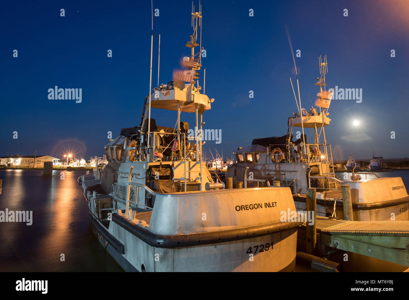 Two Coast Guard 47-foot Motor Life Boats sit at the pier at Coast Guard ...