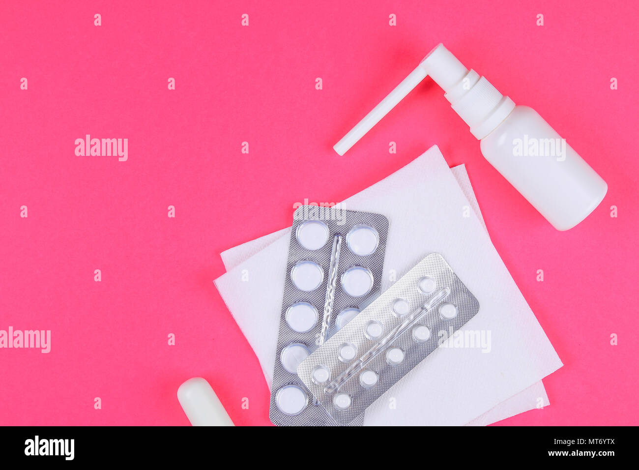 Medical remedies for colds, flu on a pink pastel background. Top view ...