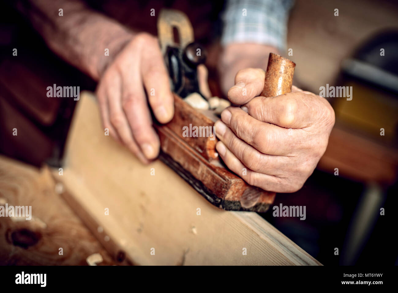 detail, old carpenter hands at work with handplaner Stock Photo - Alamy