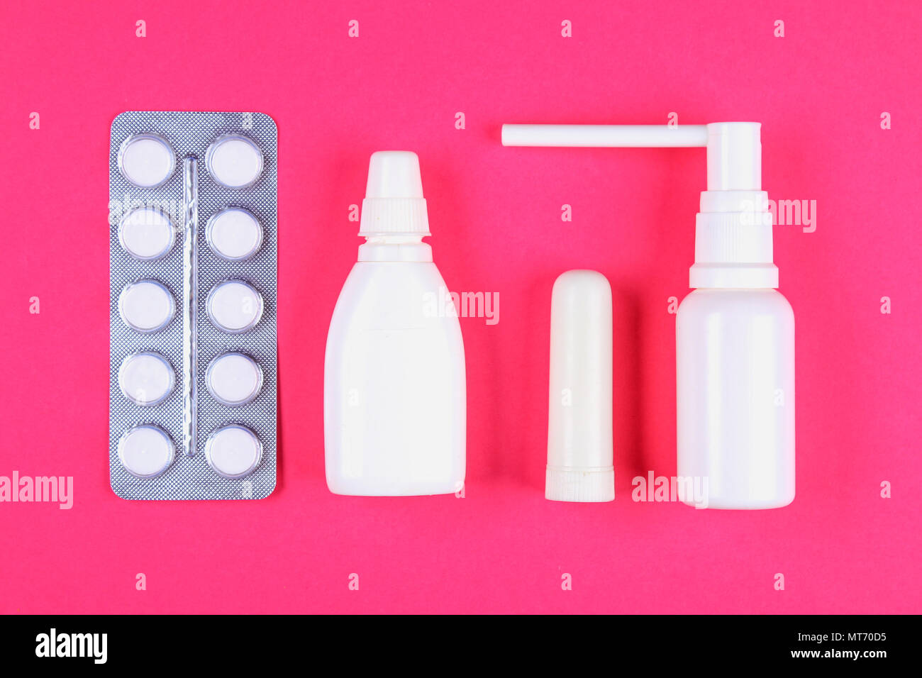 Medical remedies for colds, flu on a pink pastel background. Top view ...