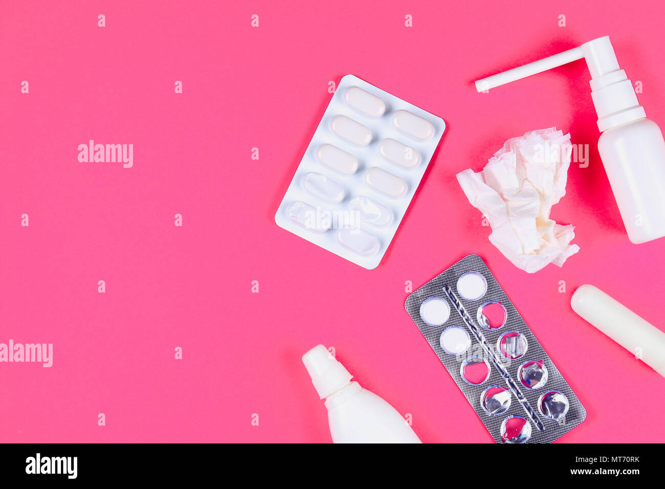 Medical remedies for colds, flu on a pink pastel background. Top view ...