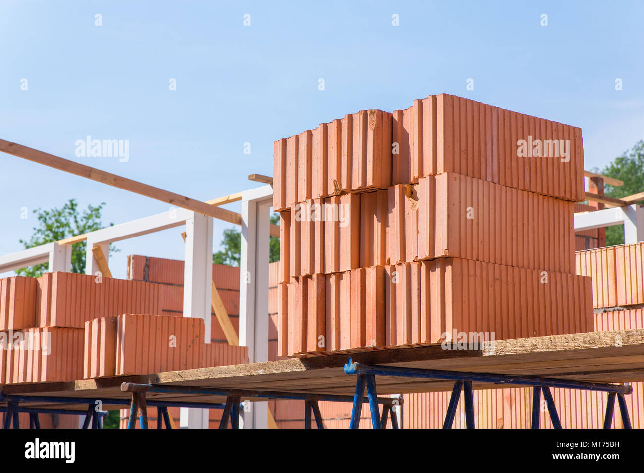 Cement building blocks stacked on pallets used for transportation and ...