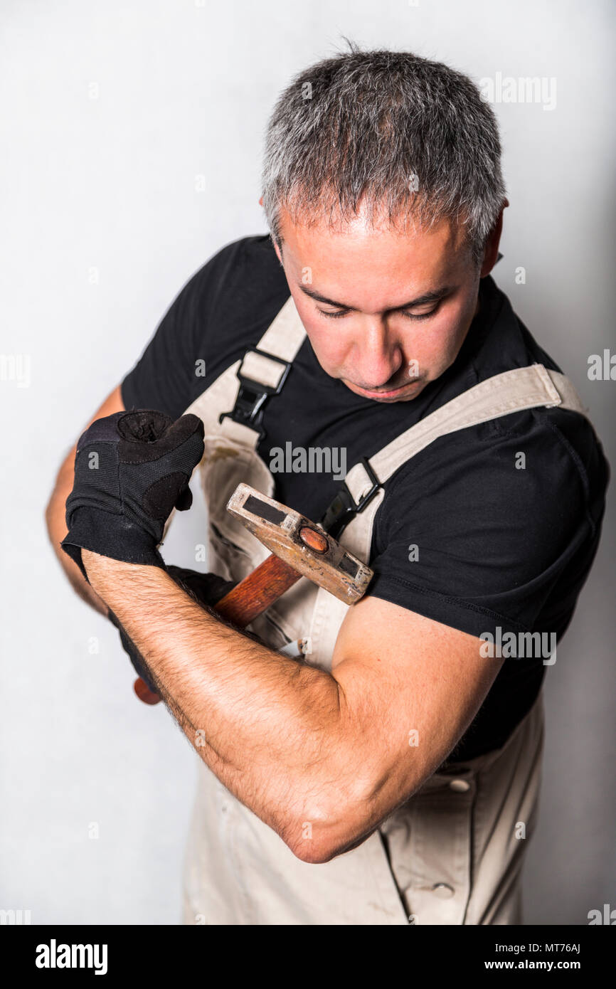 House repair man muscle hi-res stock photography and images - Alamy