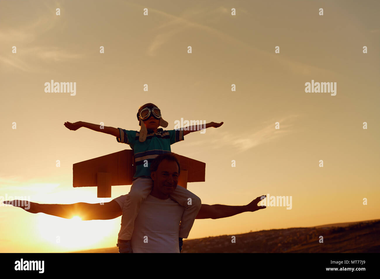 Father and son at sunset in nature Stock Photo - Alamy