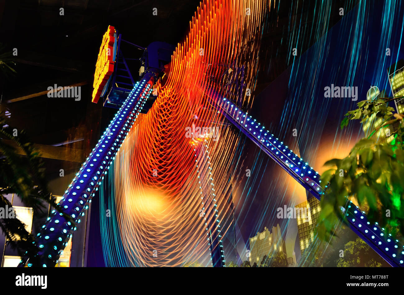 rotating and spinning merry go round with light at indoor playing ...