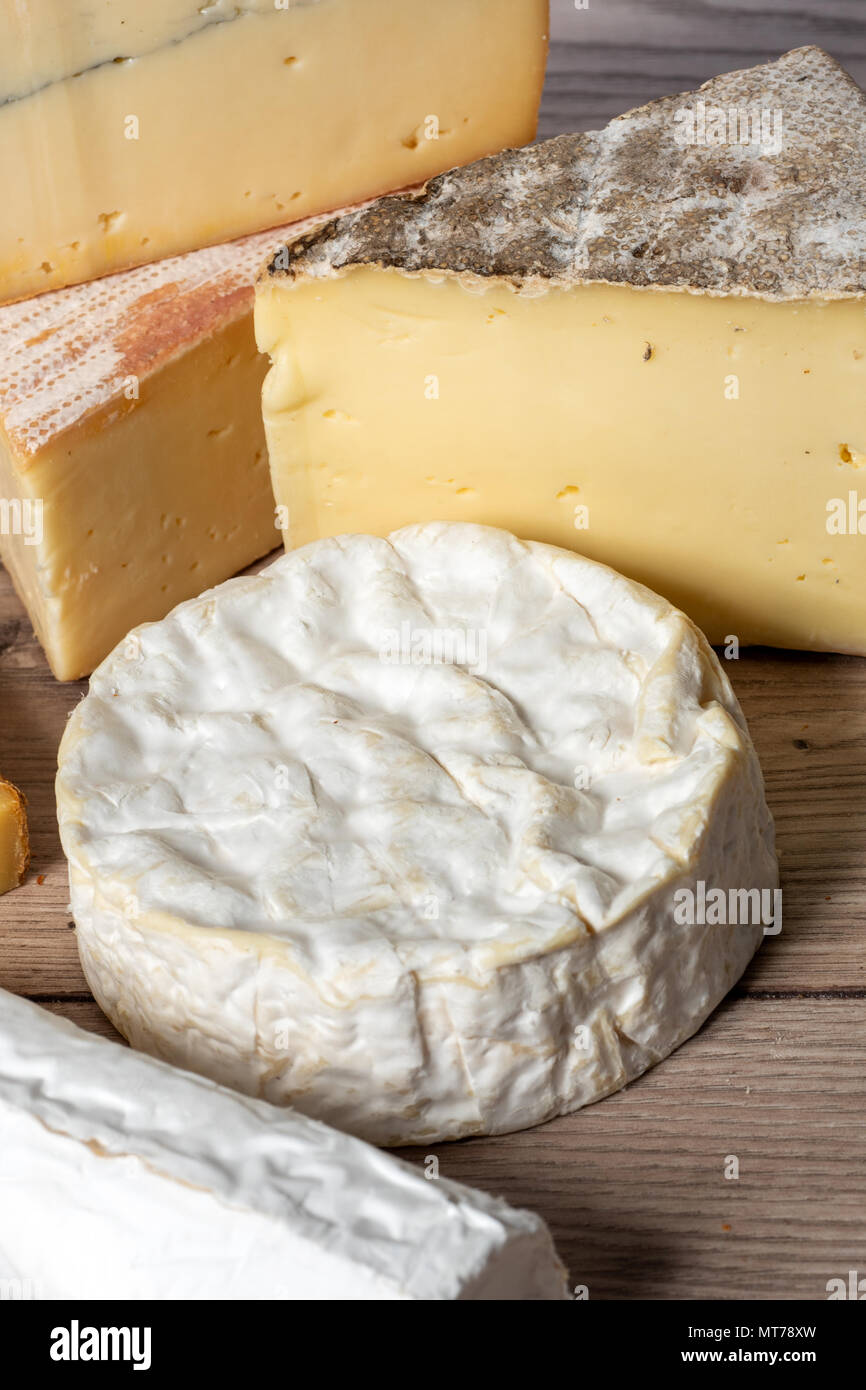 a Camembert of Normandy with different french cheeses Stock Photo - Alamy