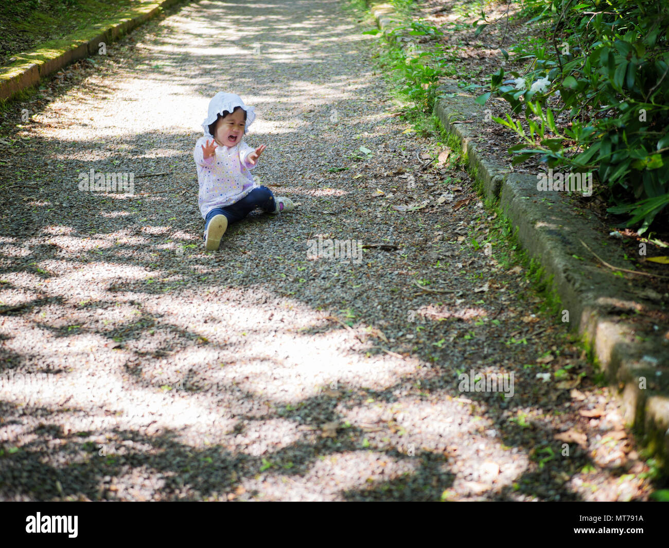 Girl on ground crying hi-res stock photography and images - Alamy