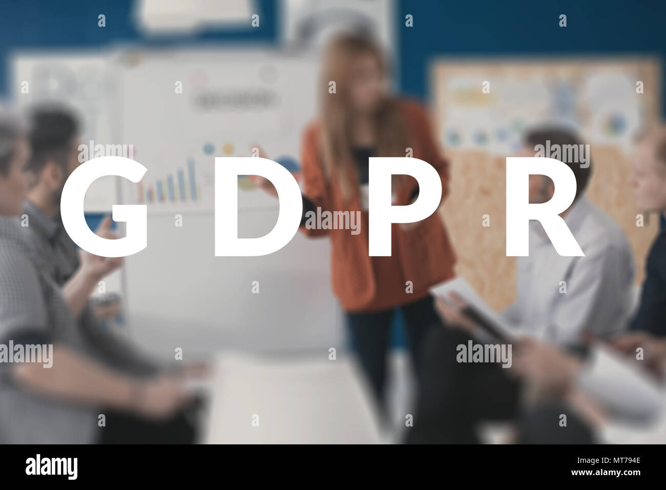 Blurred photo of a businesswoman giving a presentation about data ...