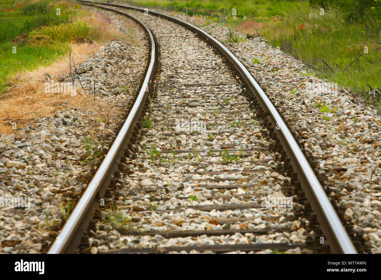 A view of the train rails in the countryside Stock Photo - Alamy