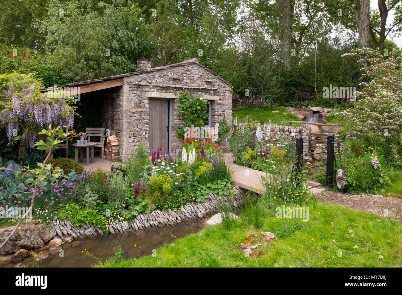 A cottage garden surrounding a stone bothy in the Welcome to Yorkshire ...