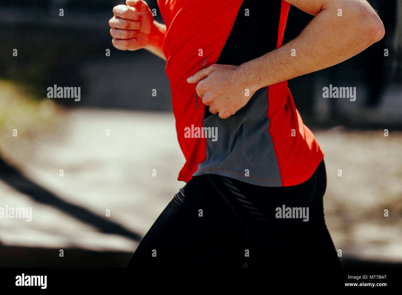Man in red shirt and black shorts hi-res stock photography and images ...