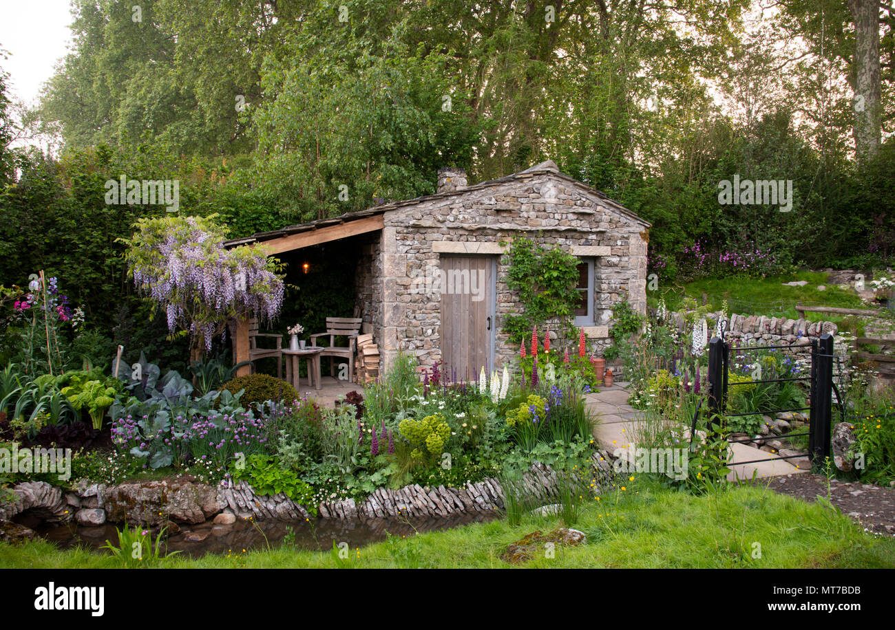 A traditional cottage garden surrounding a stone bothy in the Welcome ...