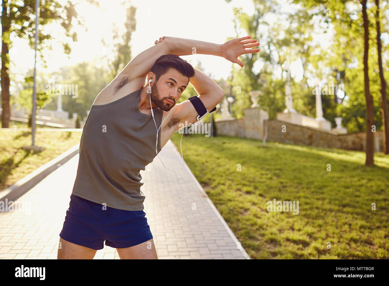 Man doing warm up exercise hi-res stock photography and images - Alamy