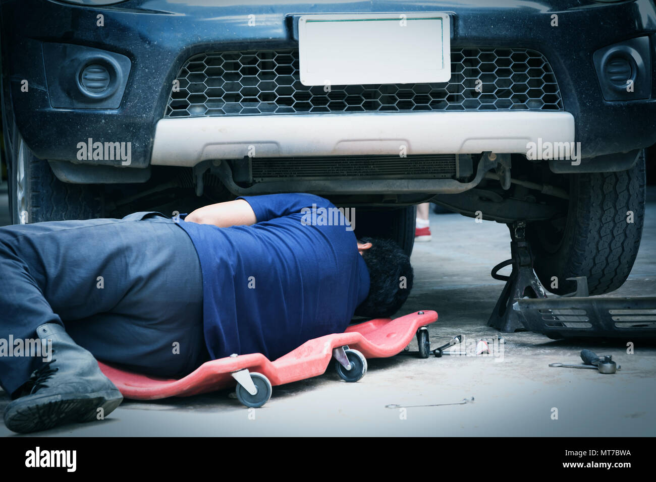 Technician checking engine of car. Auto mechanic checking car engine ...