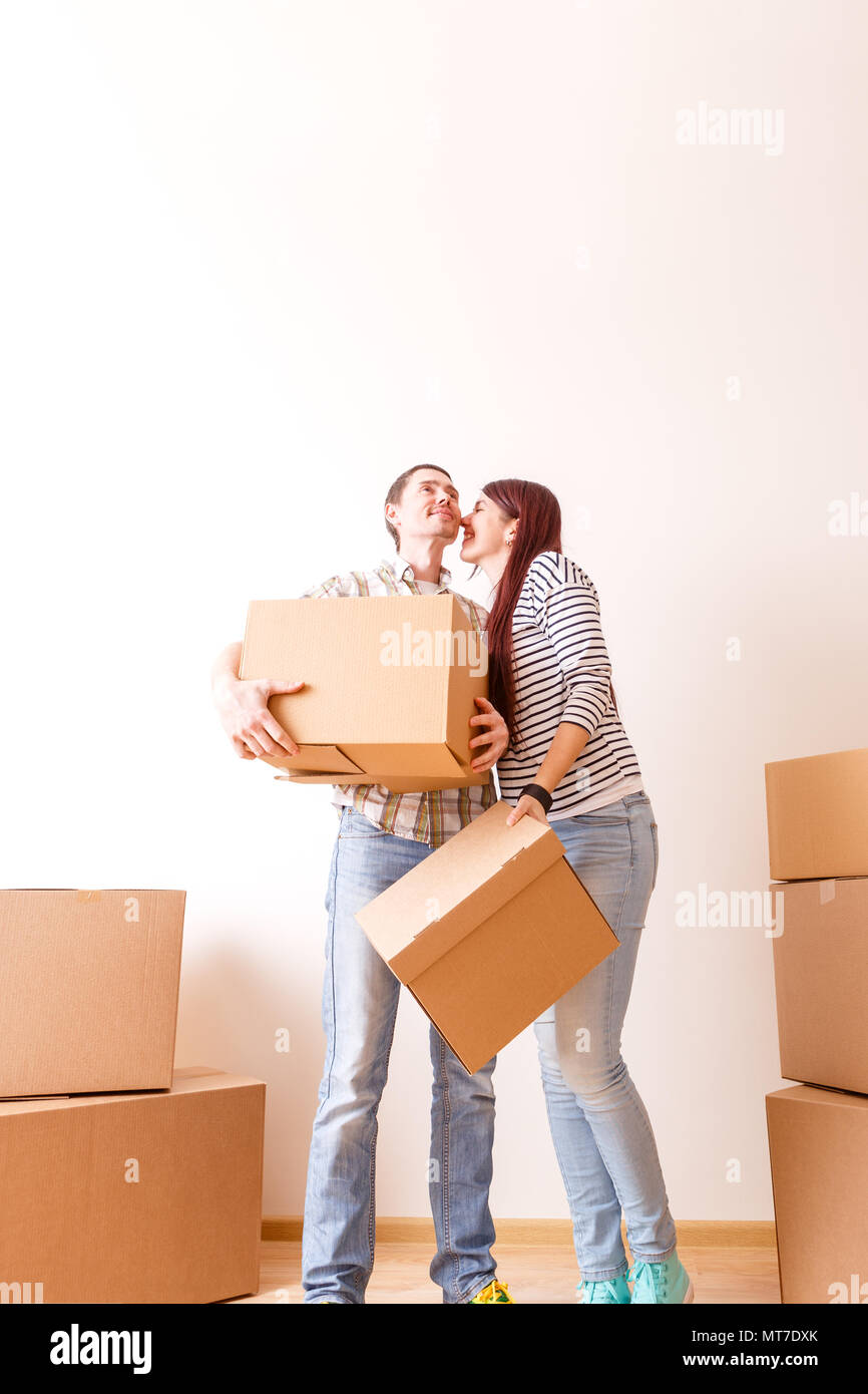 Image of couple in love among cardboard boxes Stock Photo - Alamy