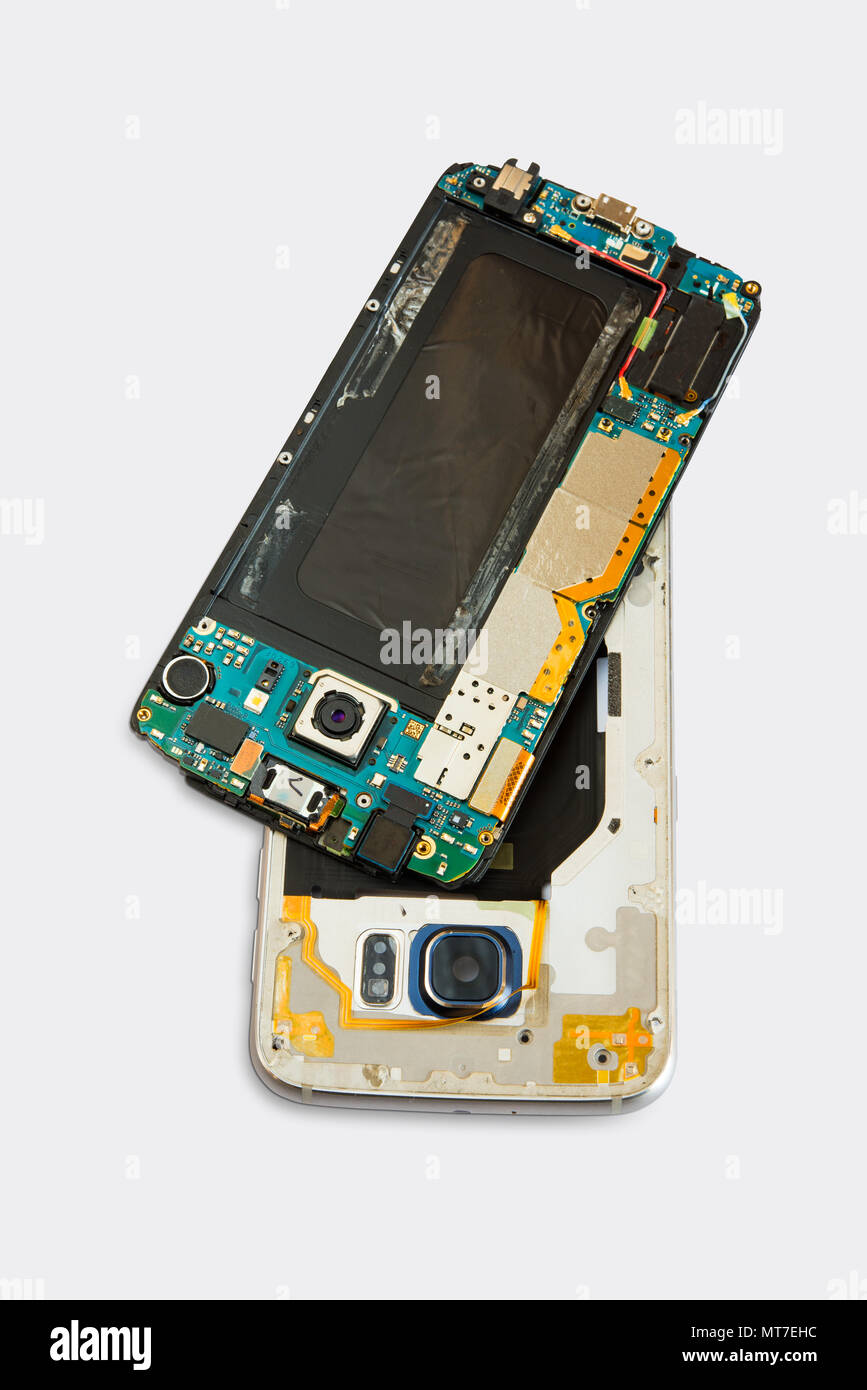 Broken cell phone with small screwdriver on white background Stock ...