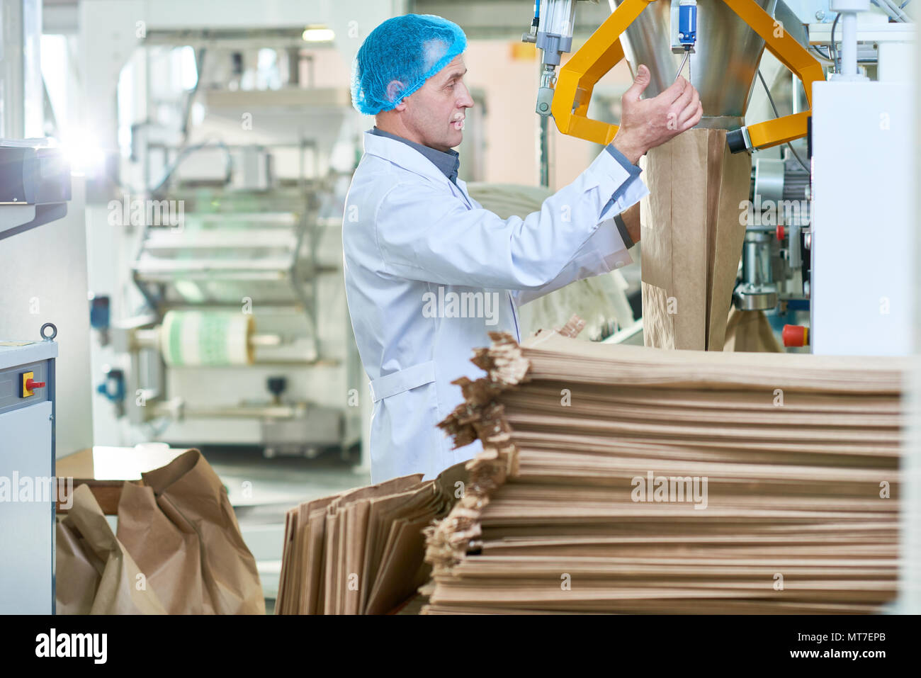 Senior Man Working at Packaging Line Stock Photo - Alamy