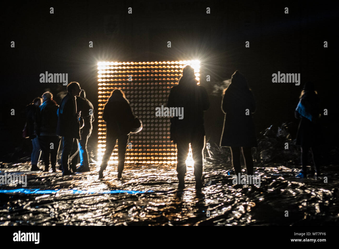 Night scene high contrast photo of people at outdoor contemporary art ...