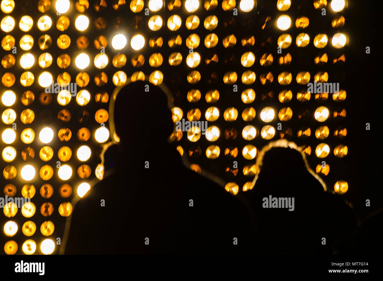 Night scene high contrast photo of people at outdoor contemporary art ...