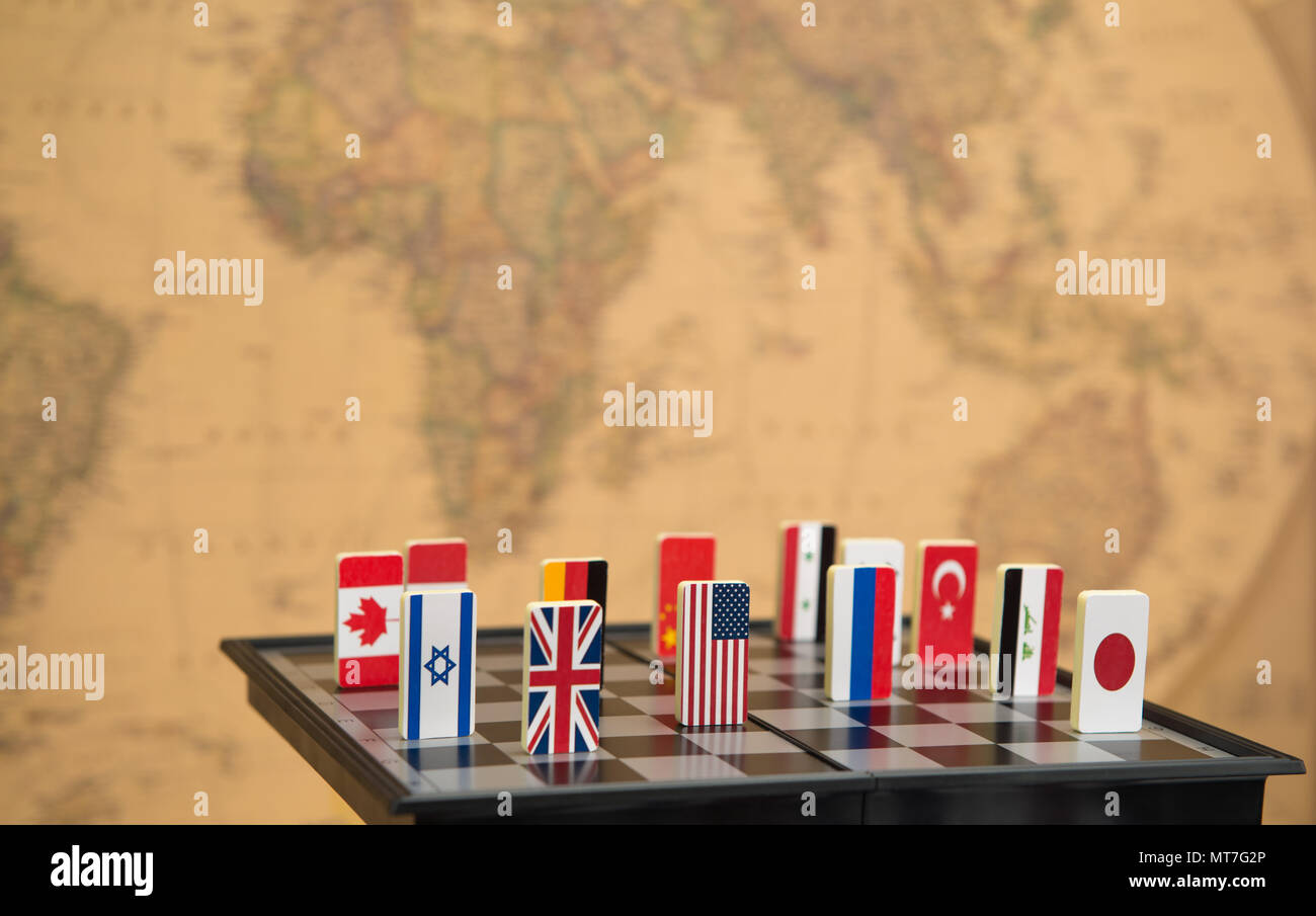 symbols of countries on the chessboard against against the background ...
