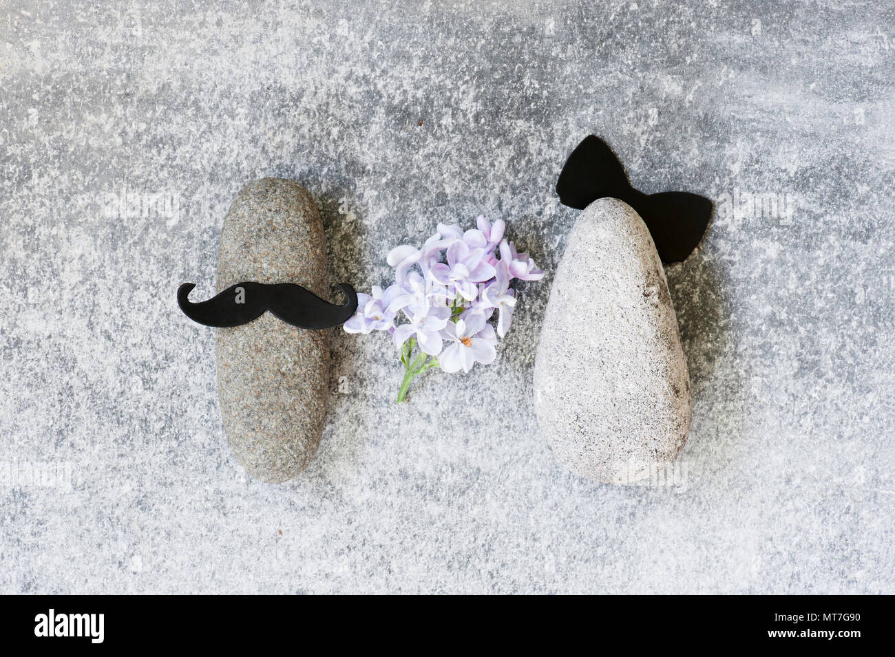 Two funny characters of stones on the textured gray background Stock ...