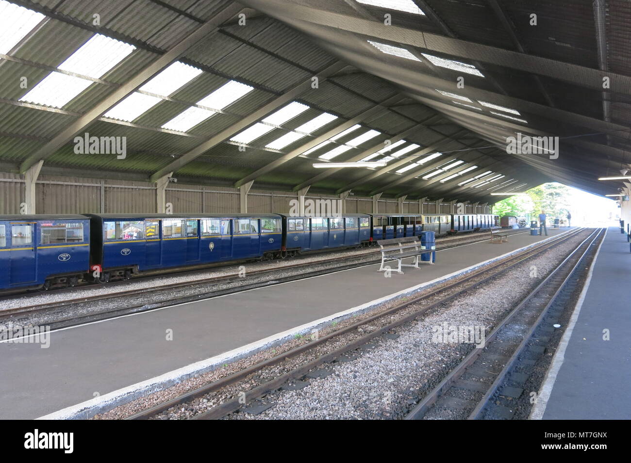 A train at the platform at New Romney station on the Romney, Hythe ...