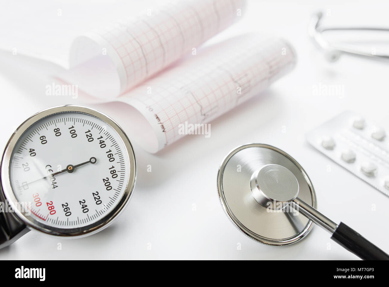 Medical concept: stethoscope, tonometer, tablets in blister and ...