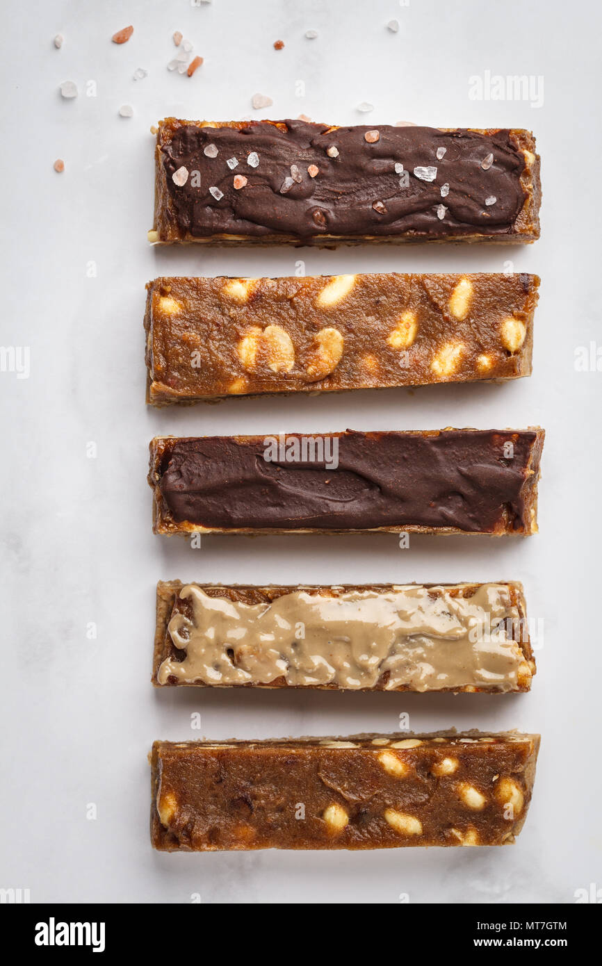 Various of vegan raw homemade nut candy bars. Healthy lifestyle and raw ...