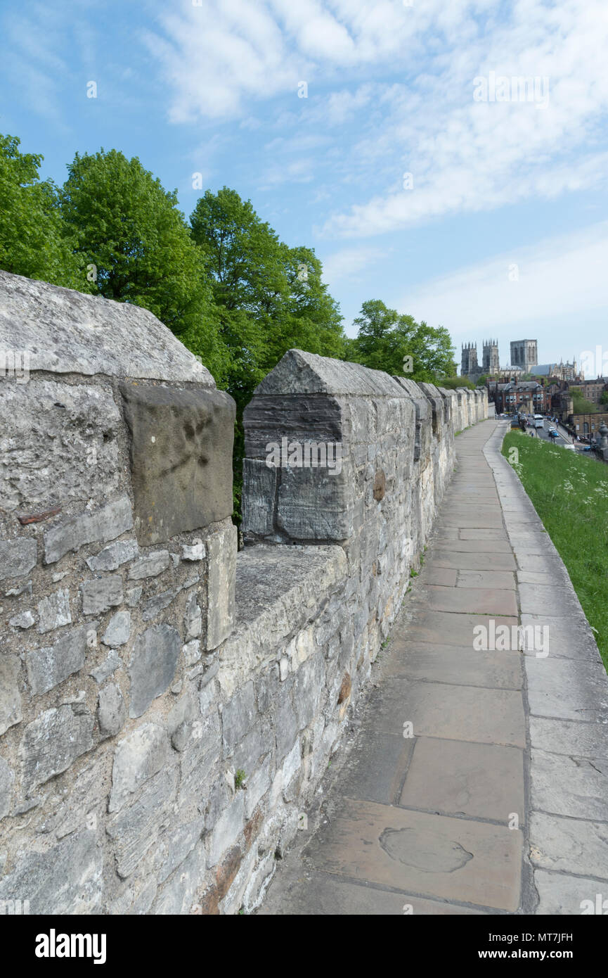 Street scene along the city wall ramparts looking toward York Minster ...