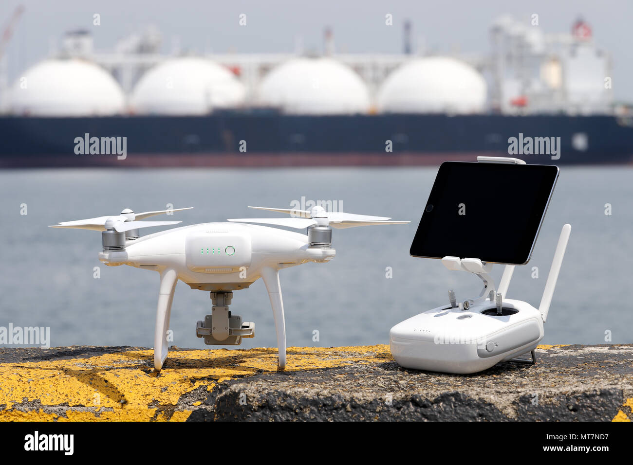 Drone with remote controller stay on concrete blocks for protection of ...