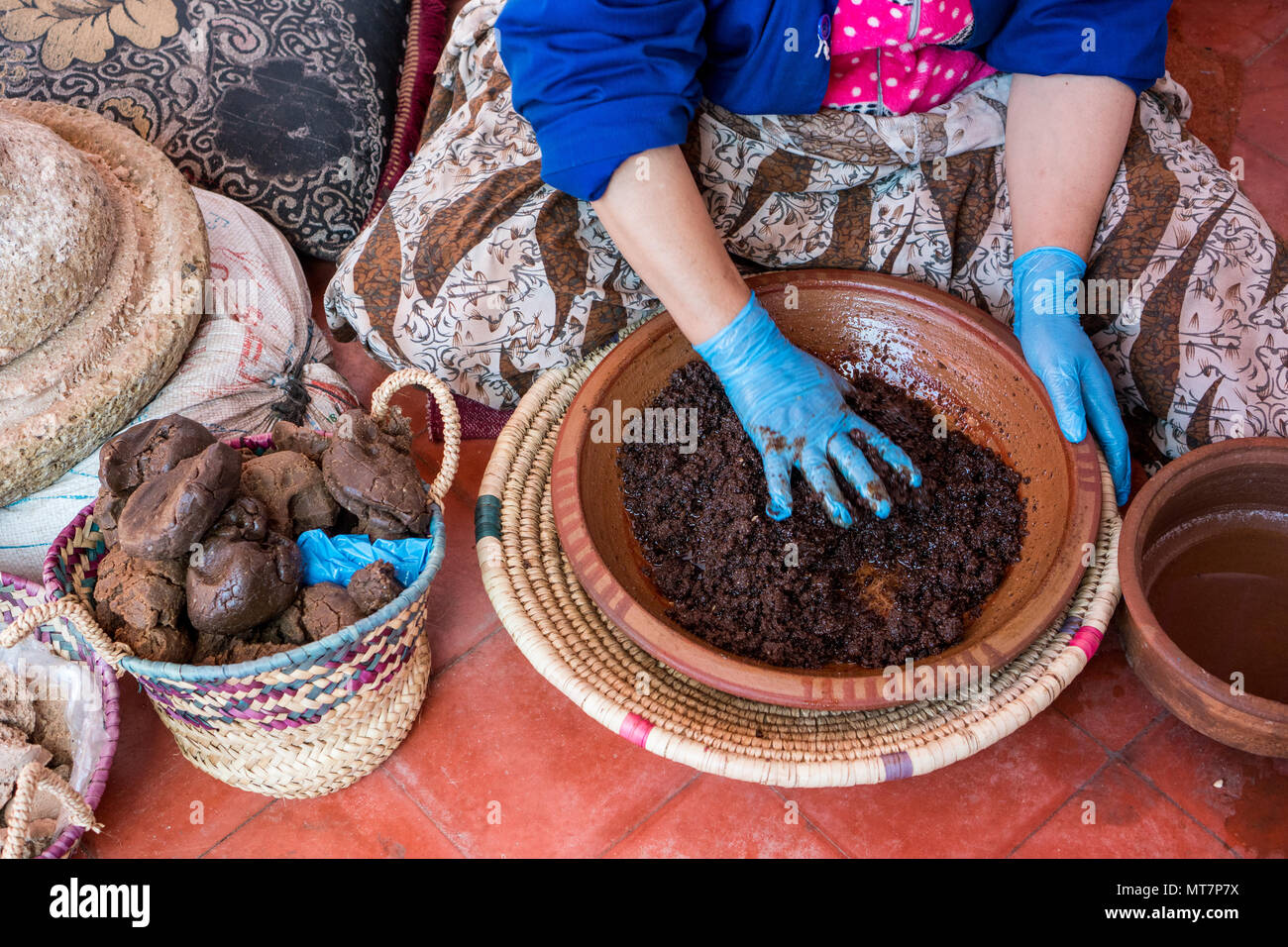 Muslim women making argan oil in traditional way in Morocco ...