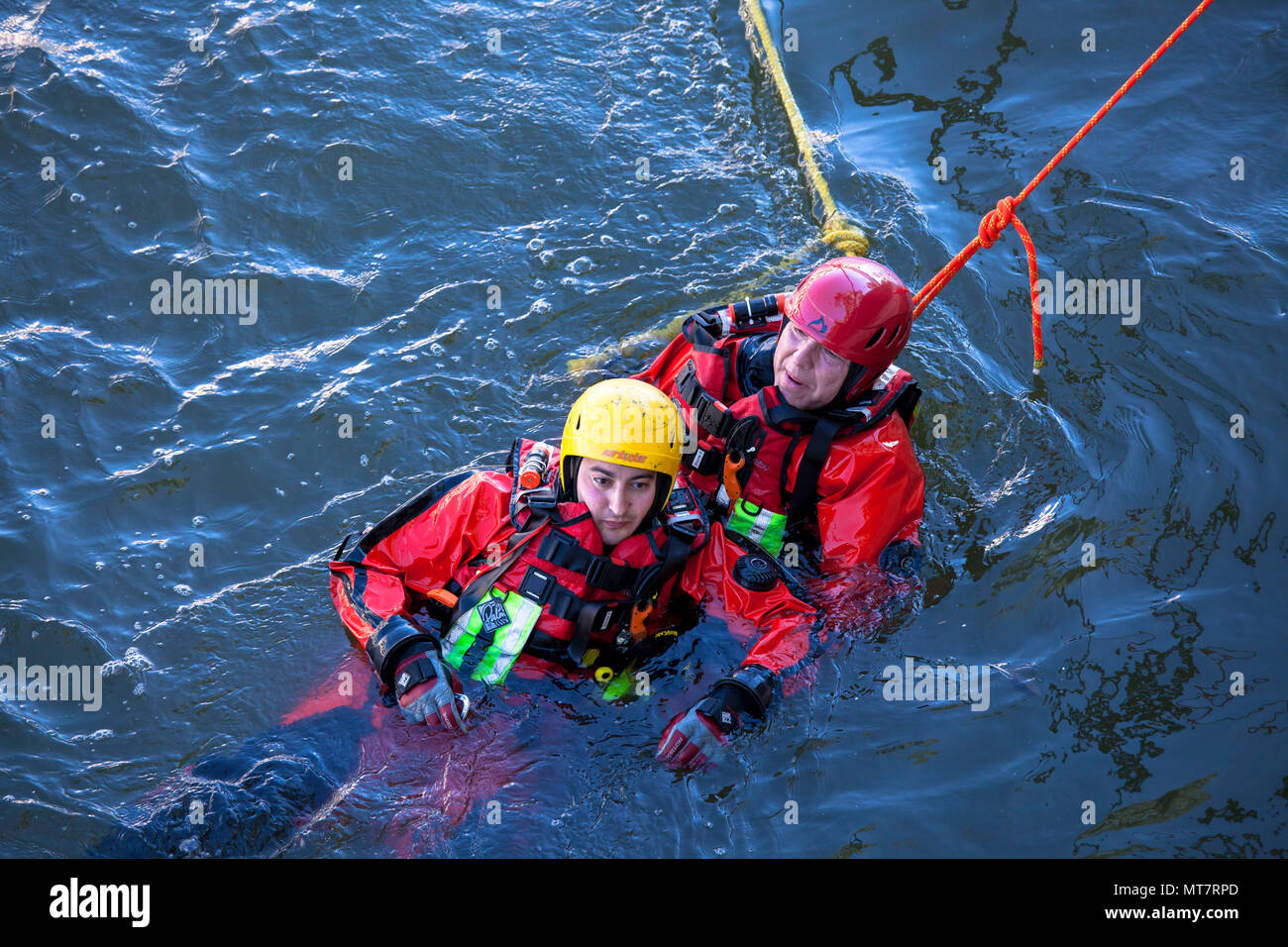 Germany, Cologne, firefighters practise the rescue of a drowning man in ...