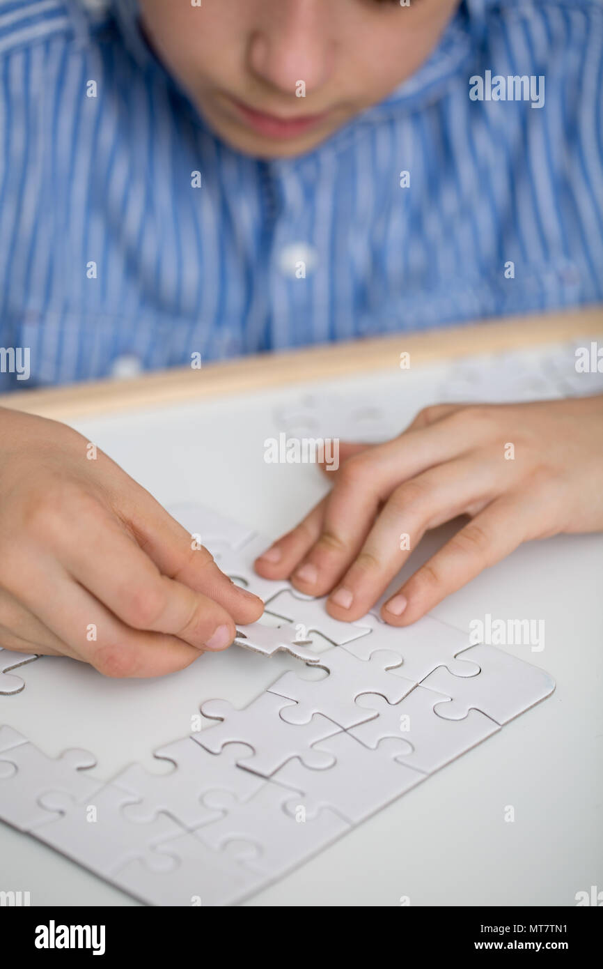Boy with a jigsaw hi-res stock photography and images - Alamy