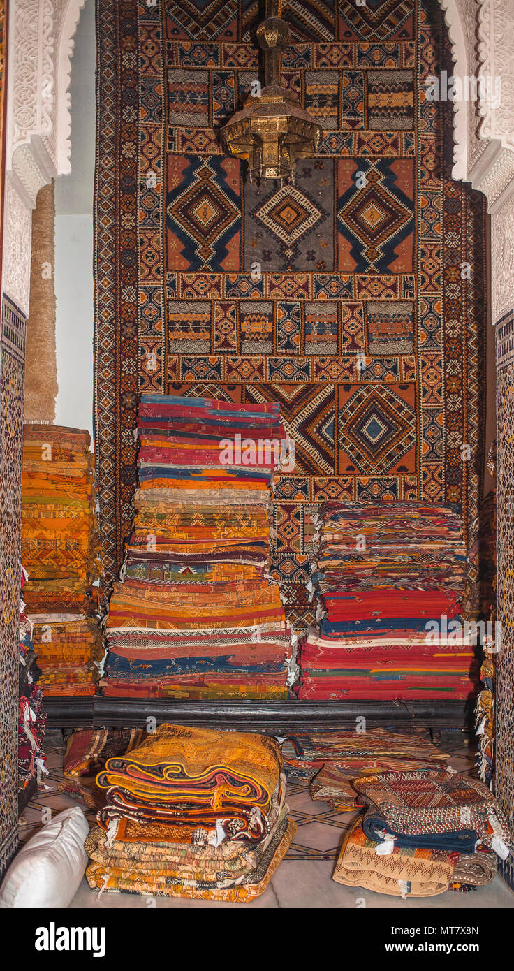 Typical colourful woollen rugs and handy-craft articles on display in a ...