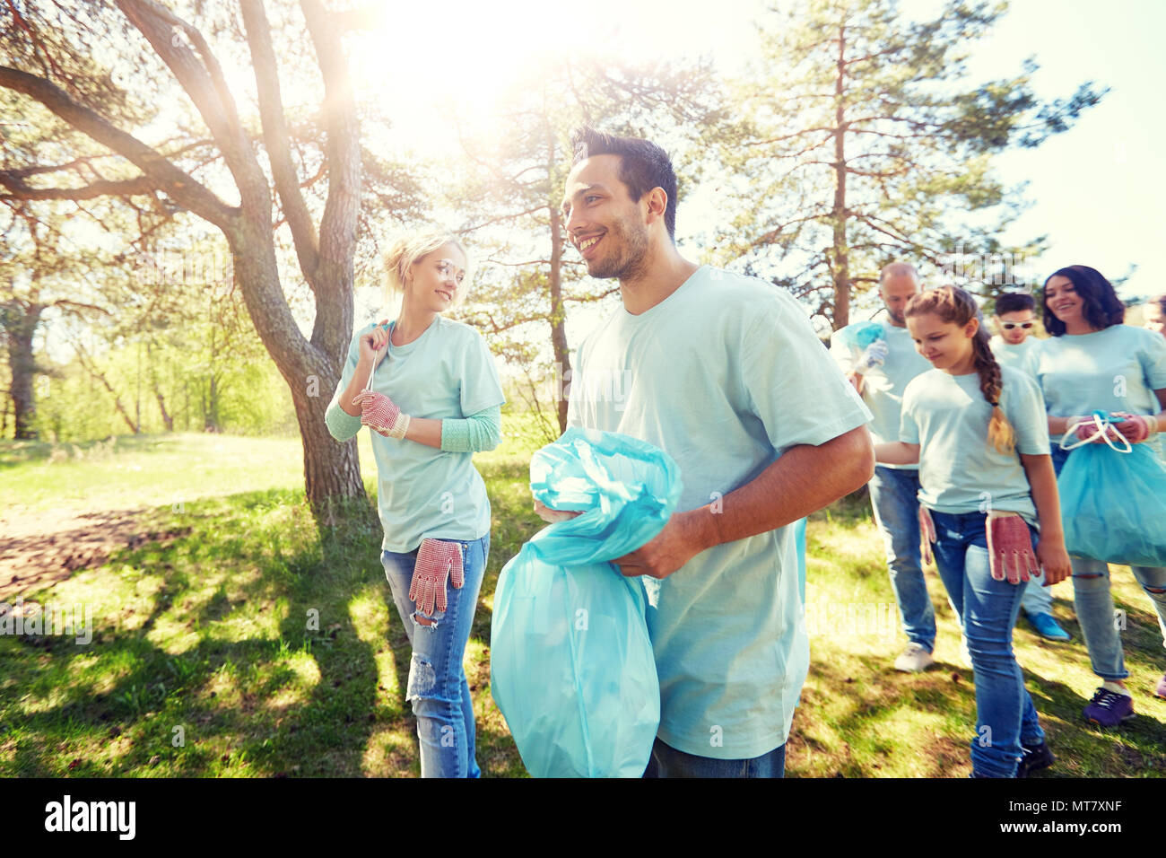 volunteers with garbage bags walking outdoors Stock Photo - Alamy