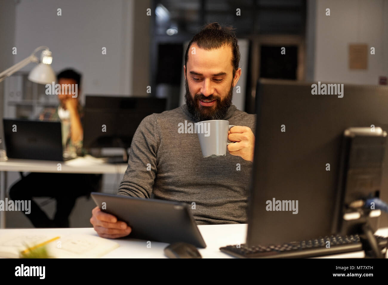 man with tablet pc and cup of coffee Stock Photo - Alamy