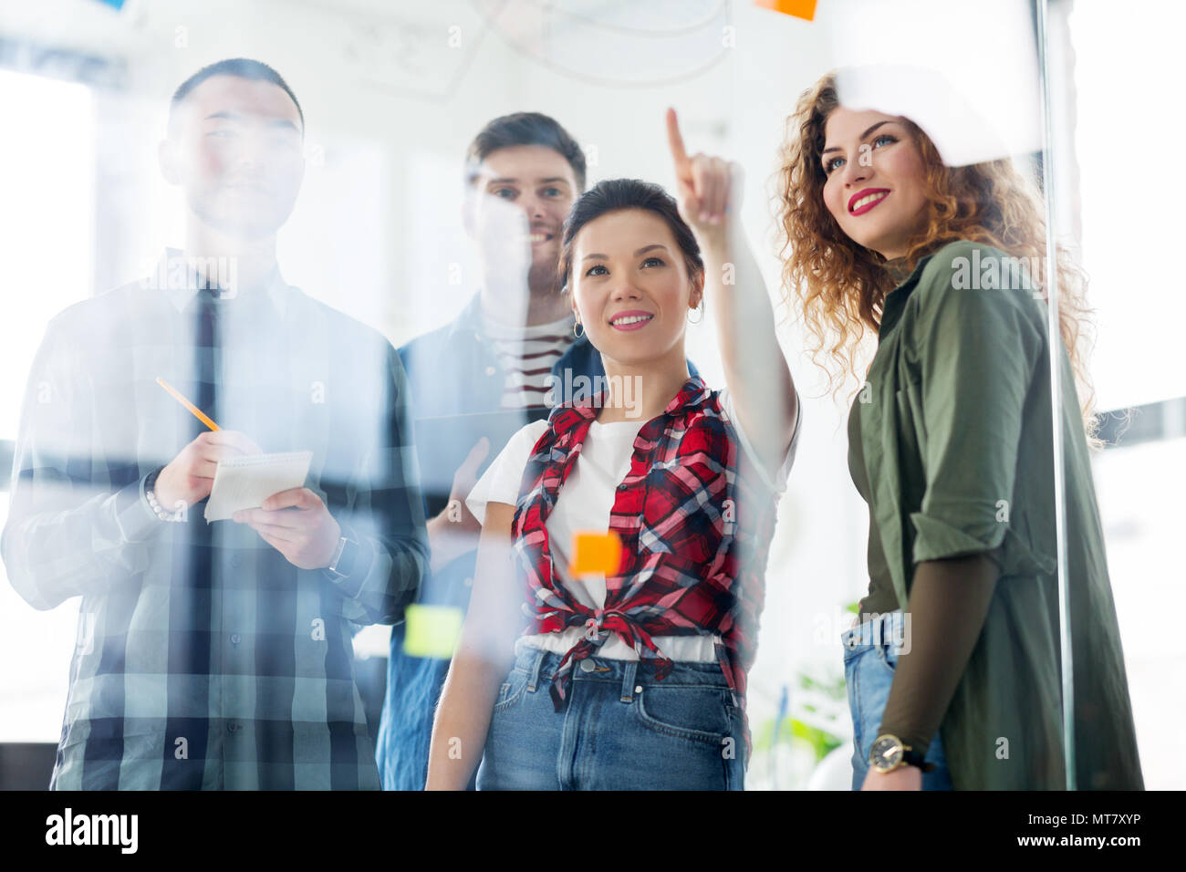 Happy creative team looking chart hi-res stock photography and images ...