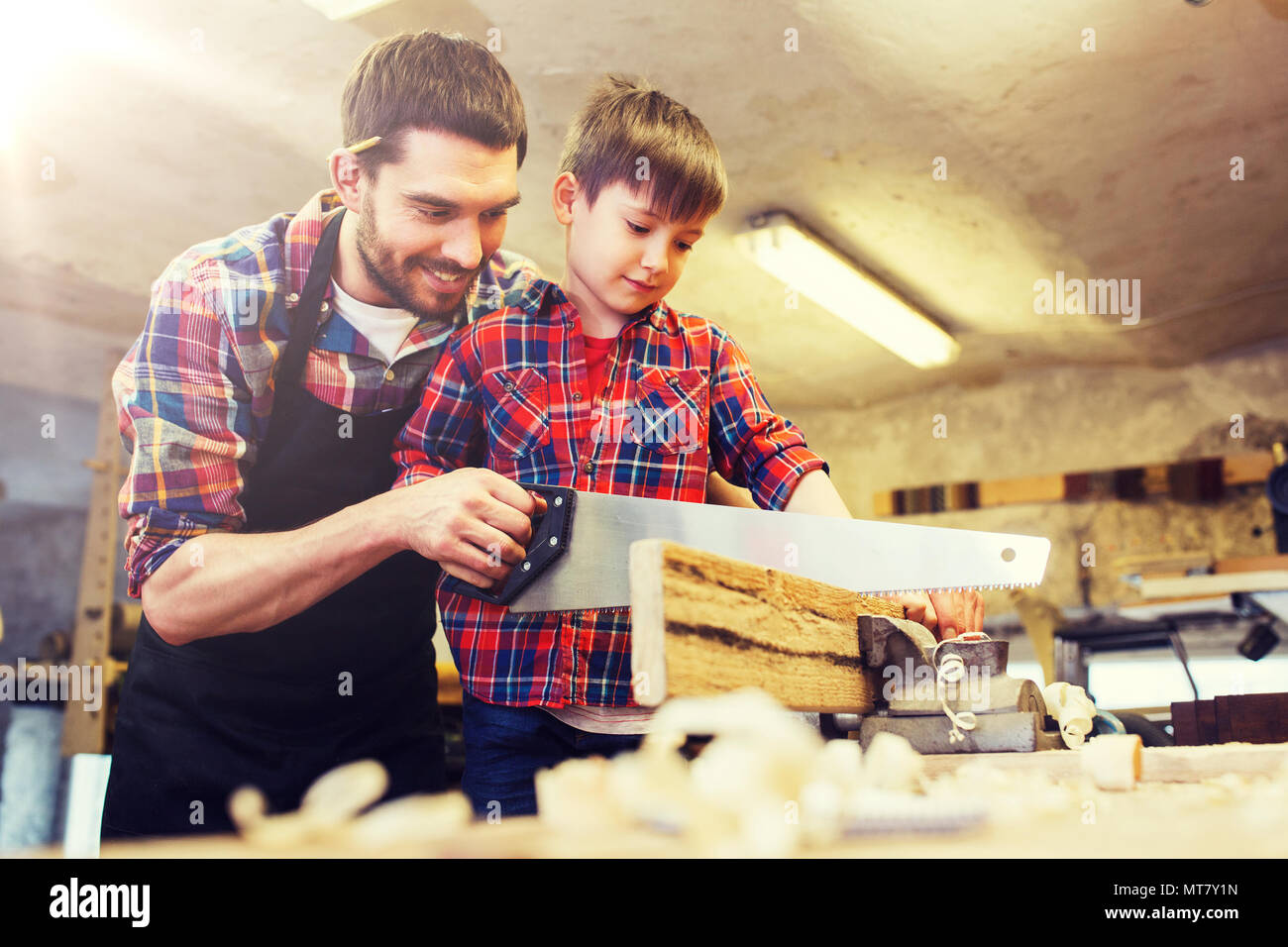 Boy working hacksaw hi-res stock photography and images - Alamy