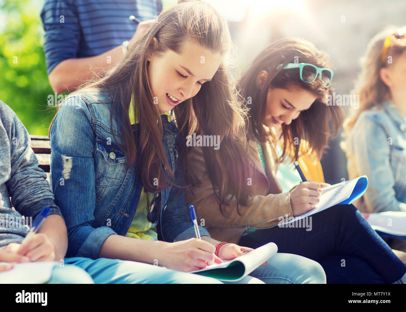 group of students with notebooks at school yard Stock Photo - Alamy