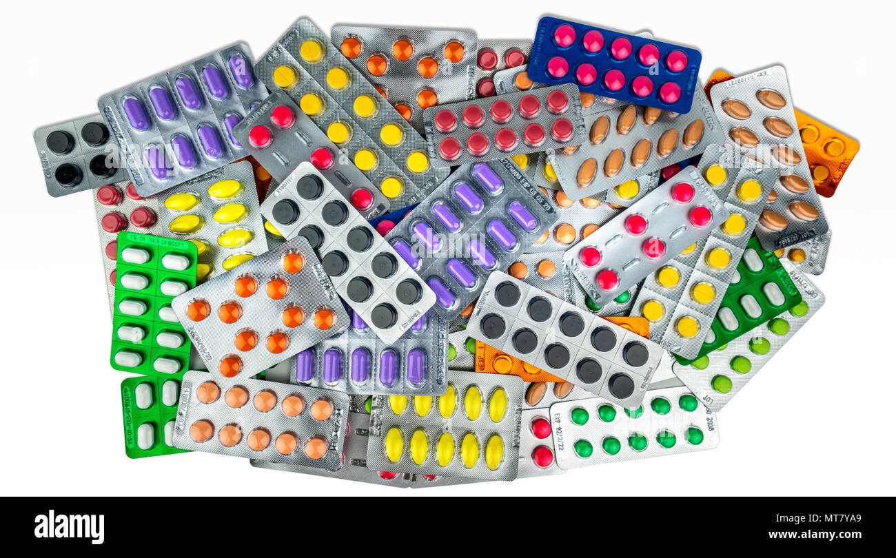 Many of tablet pills isolated on white background. Yellow, purple ...