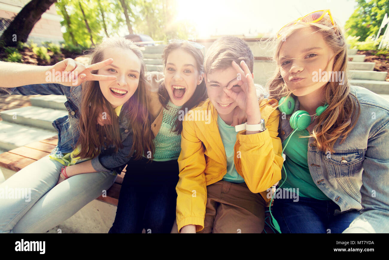 happy teenage students or friends having fun Stock Photo - Alamy