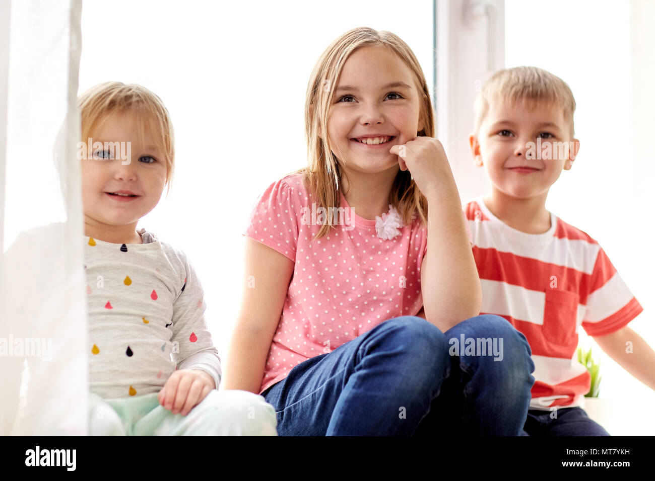 happy little kids having fun at window Stock Photo - Alamy