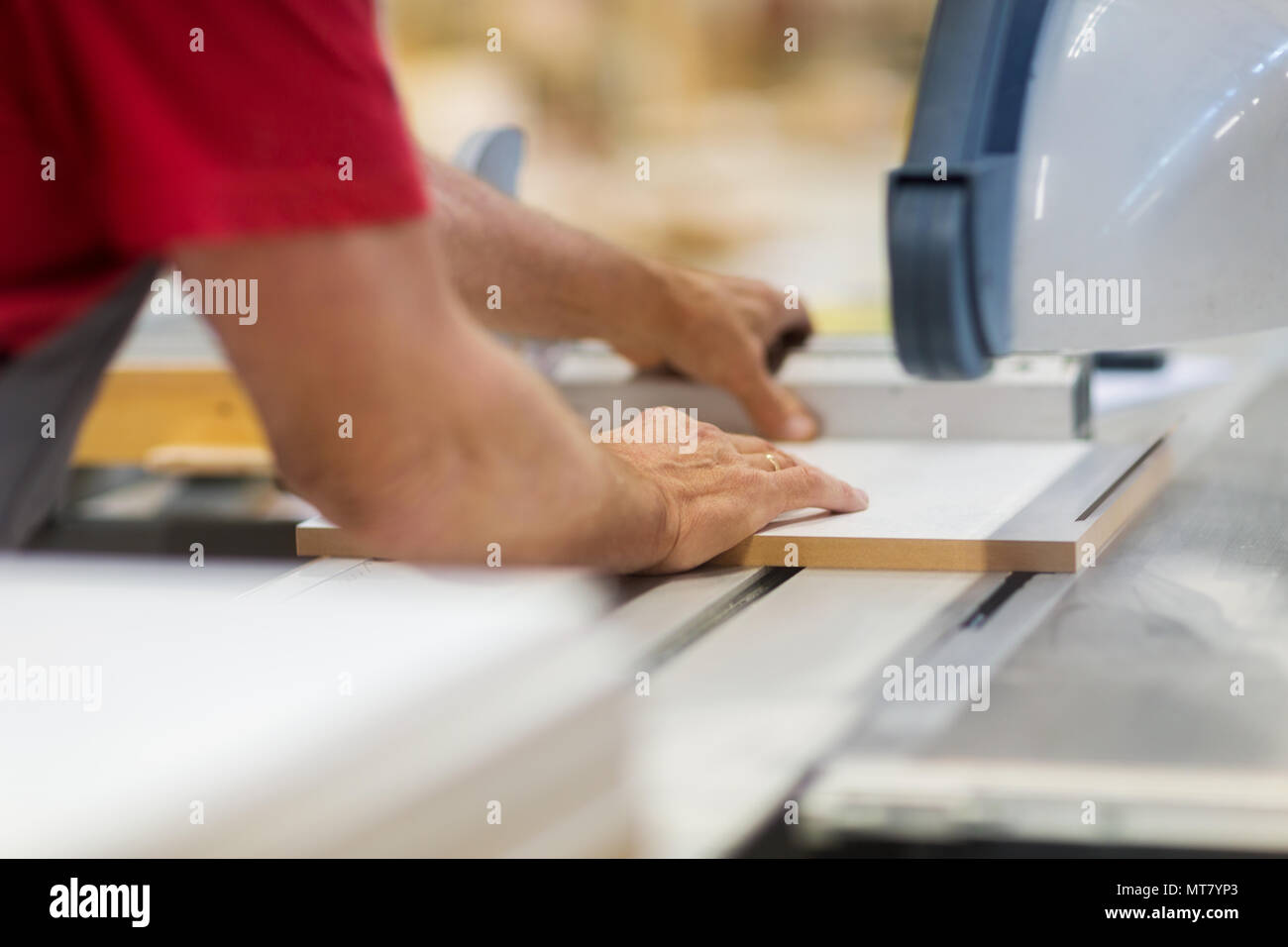 carpenter with panel saw and fibreboard at factory Stock Photo - Alamy