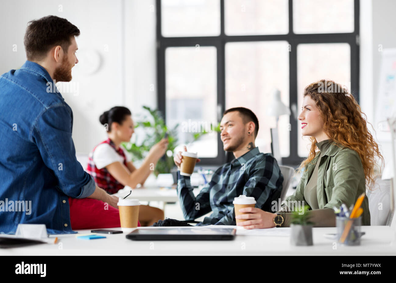 creative team drinking coffee at office Stock Photo - Alamy