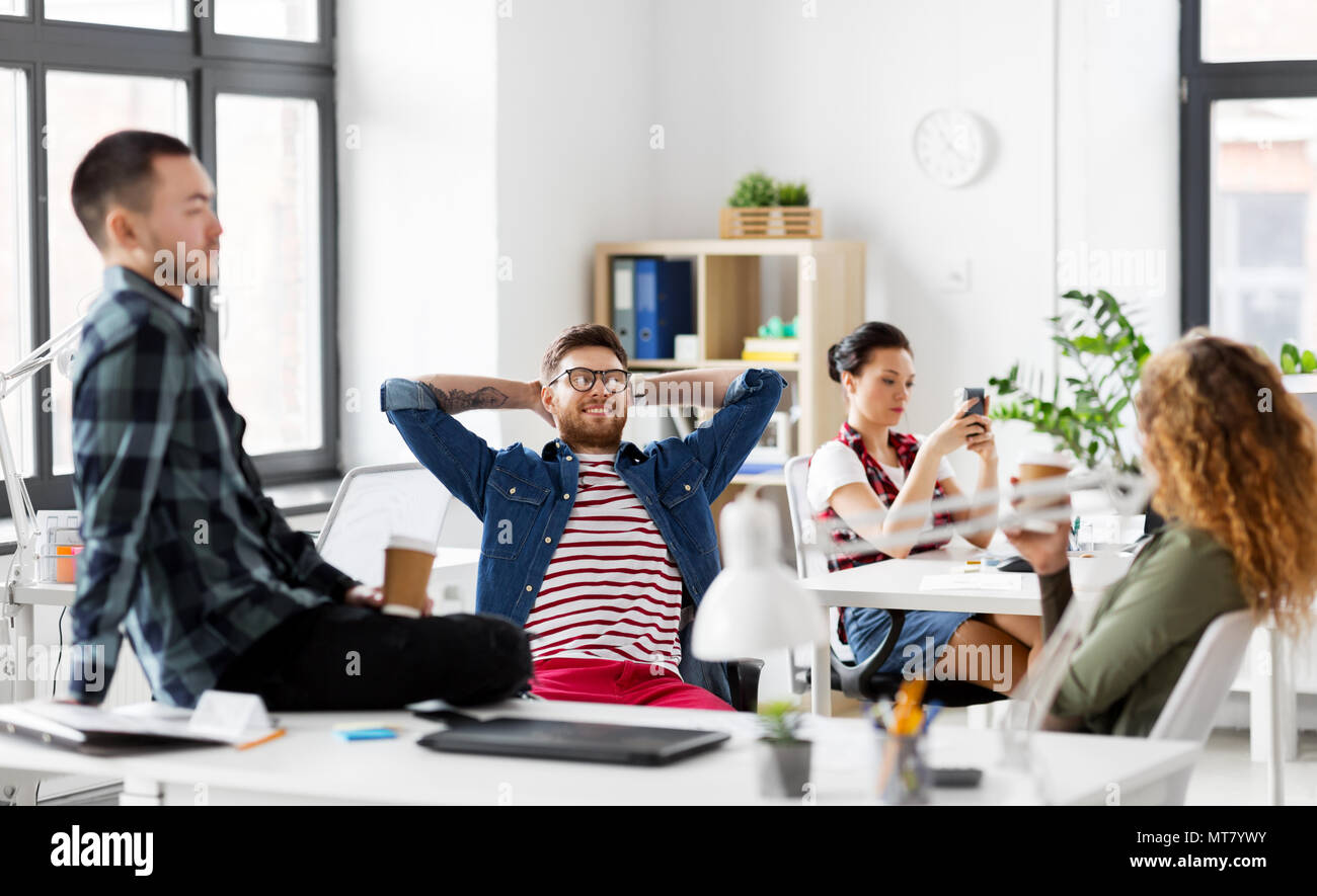 creative team drinking coffee at office Stock Photo - Alamy
