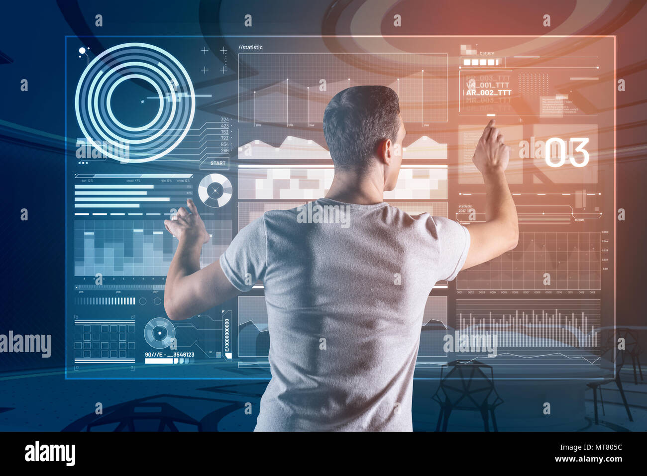 Professional programmer working alone and looking attentive Stock Photo - Alamy