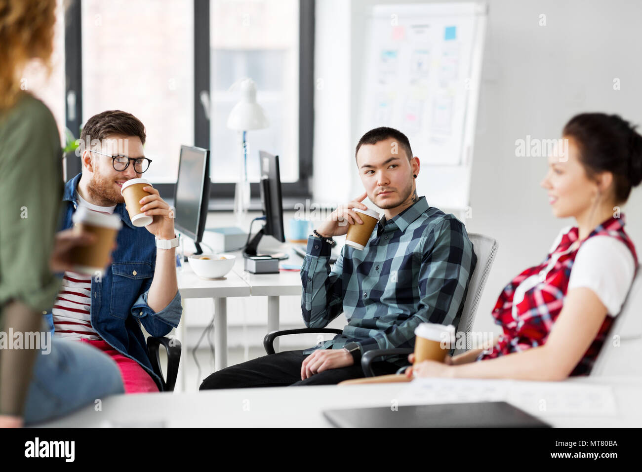 creative team drinking coffee at office Stock Photo - Alamy